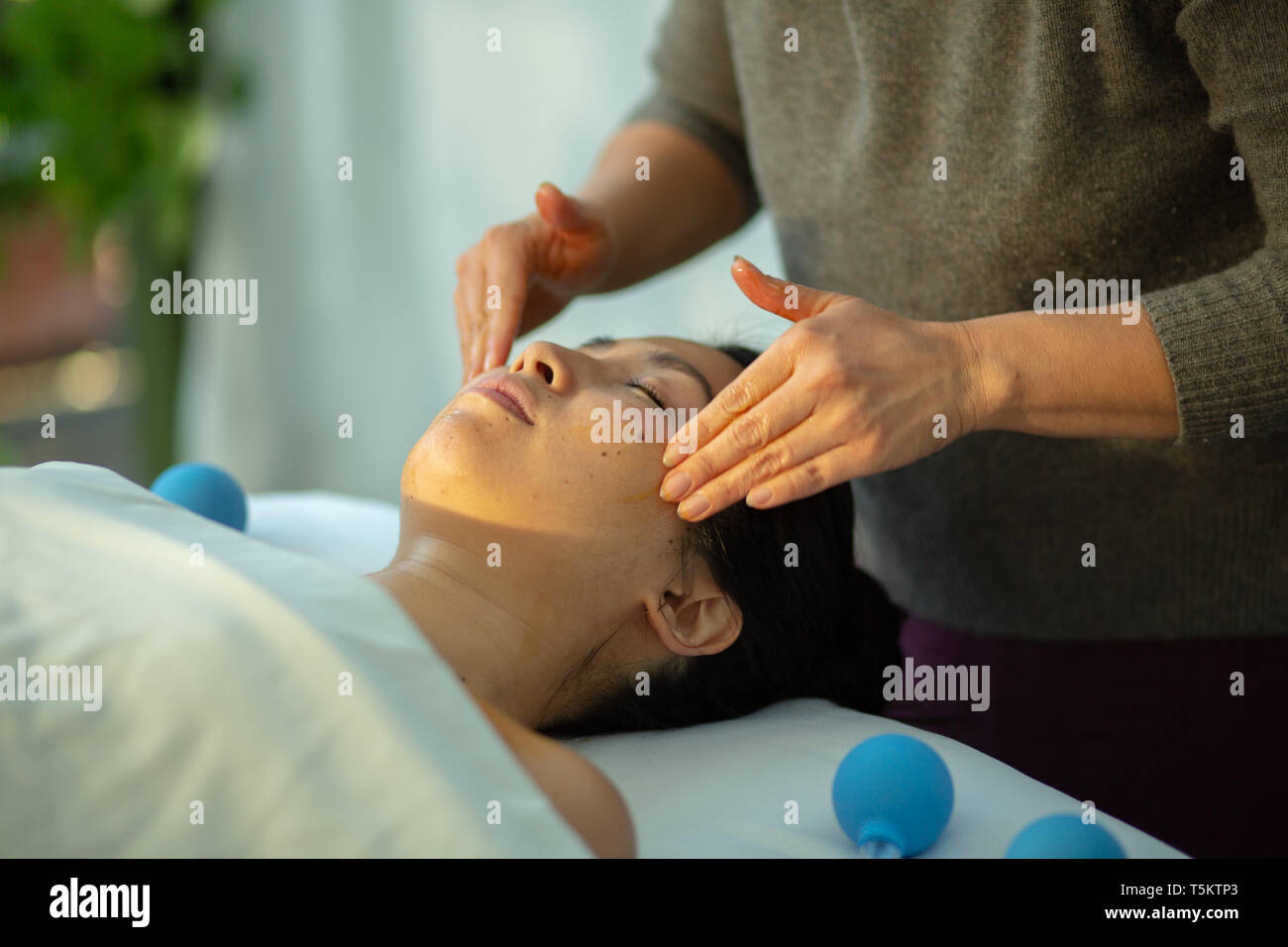 Woman receives facial cupping massage facial rejuvenation at ...