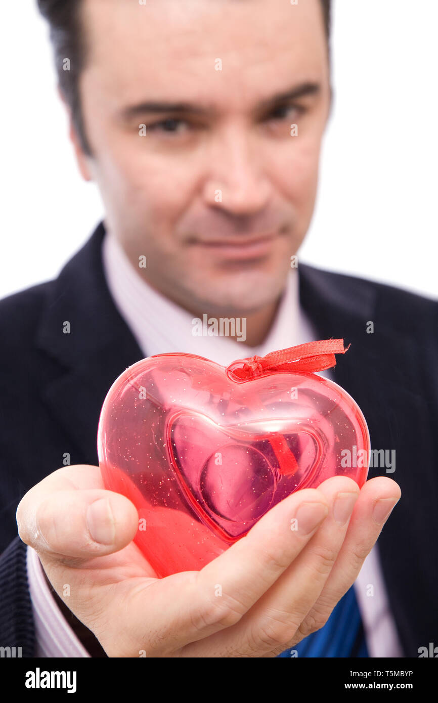young and handsome man giving a heart shape for valentines concept ...