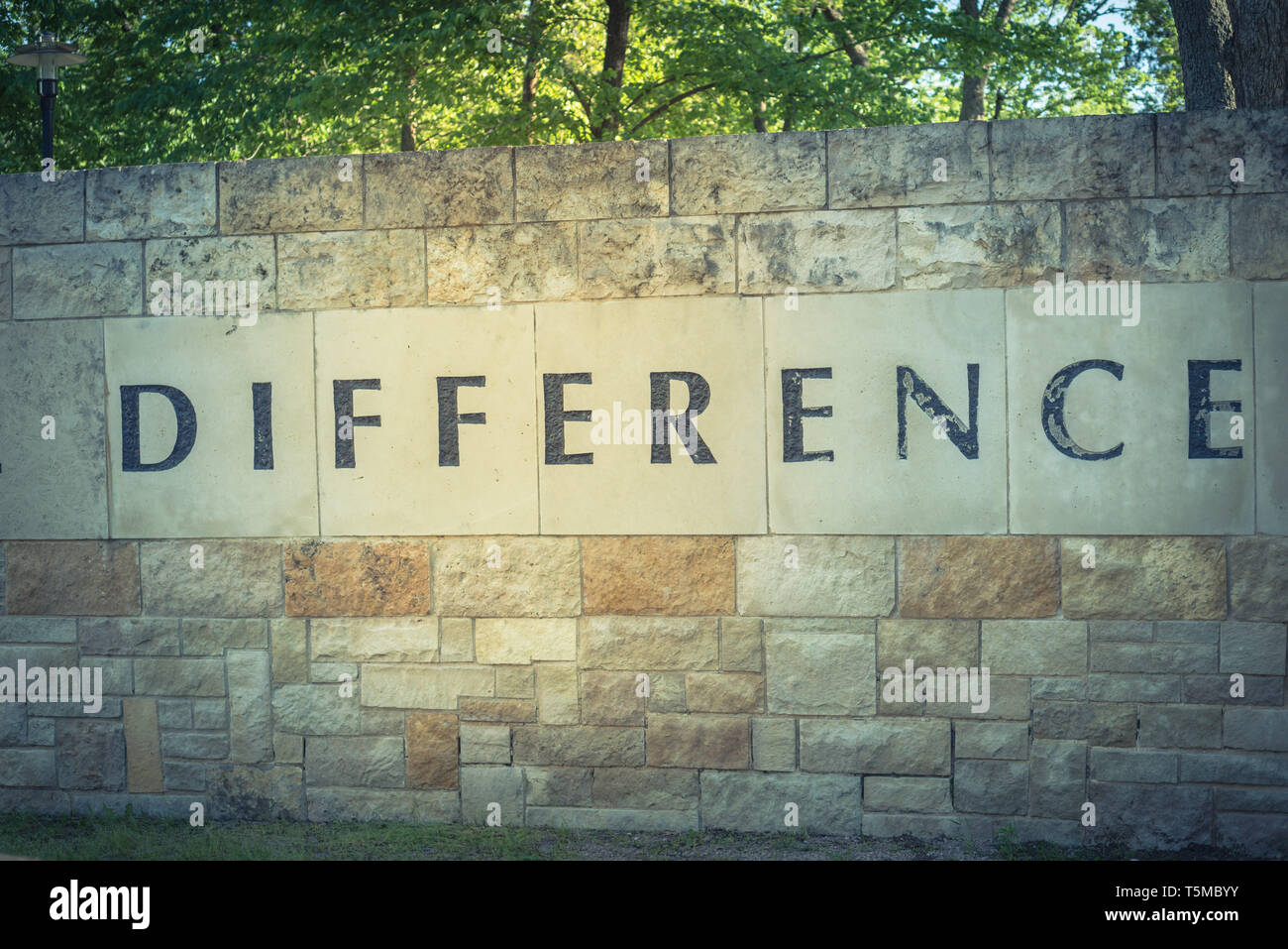 Old stone texture of Difference word on wall brick Stock Photo - Alamy