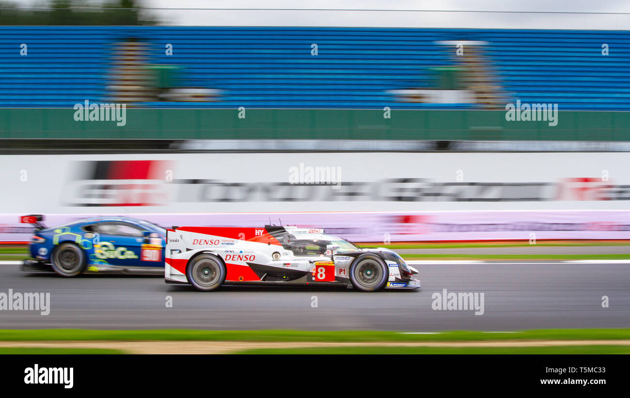 A Toyota LMP1 Hybrid passes an Aston Martin during the WEC 6 Hours of ...