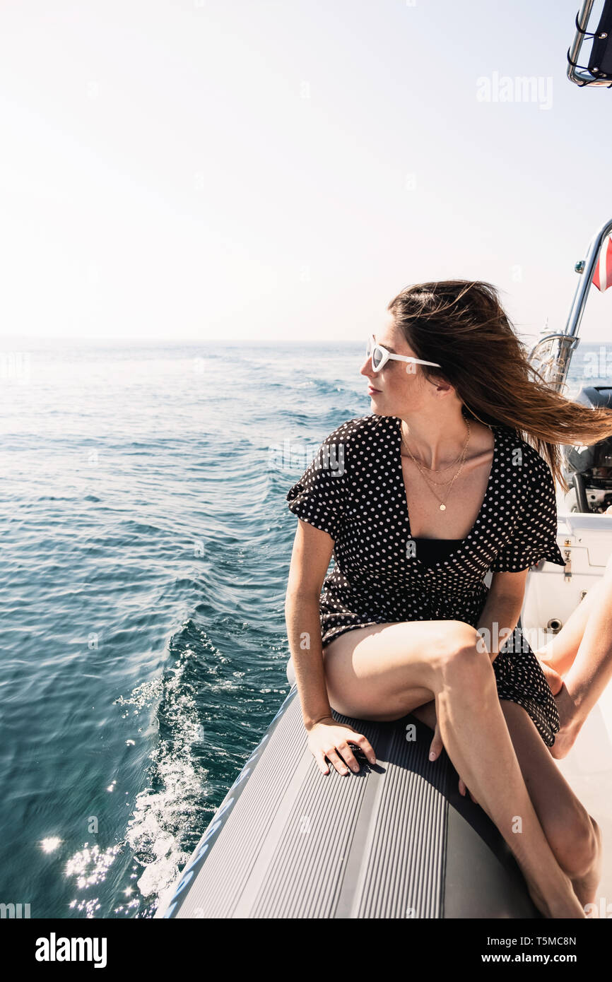 Woman in Dress Rides on Boat Stock Photo - Alamy