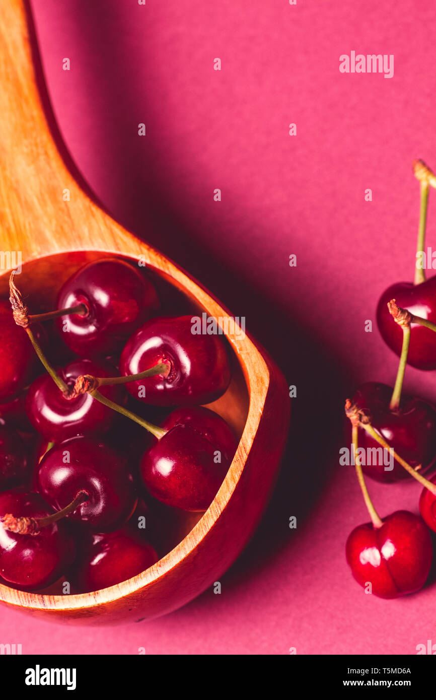 seasonal red fruits on a background of the same color Stock Photo - Alamy