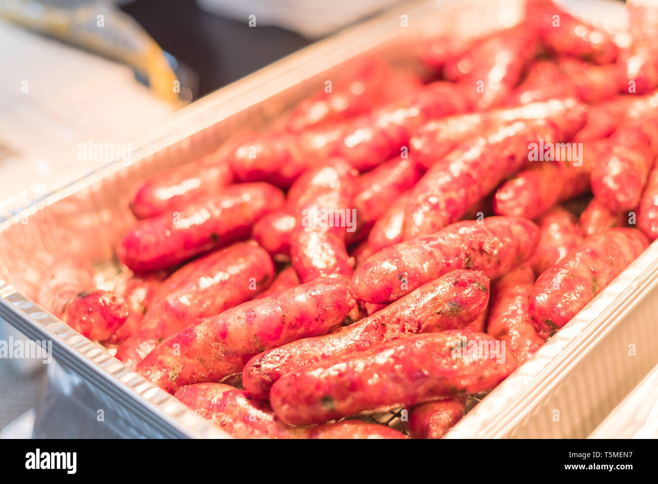 Asian sausages on aluminum foil cases at market stand Stock Photo - Alamy