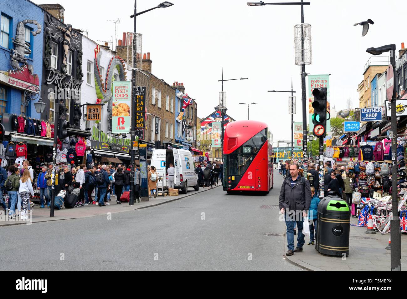 A crowded Camden Town high Street with tourists enjoying the colourful ...