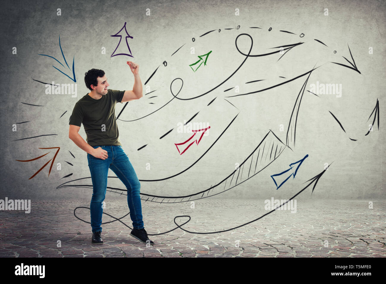 Contented casual young man dancing by the music, moves feeling the ...