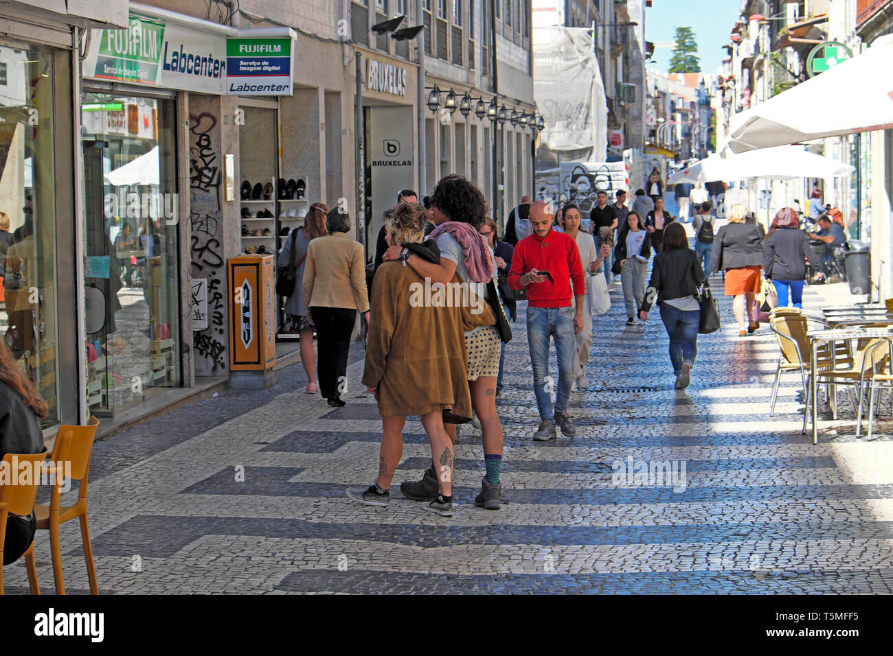 People, shoppers, pedestrians walking on the pedestrianised area of Rua ...