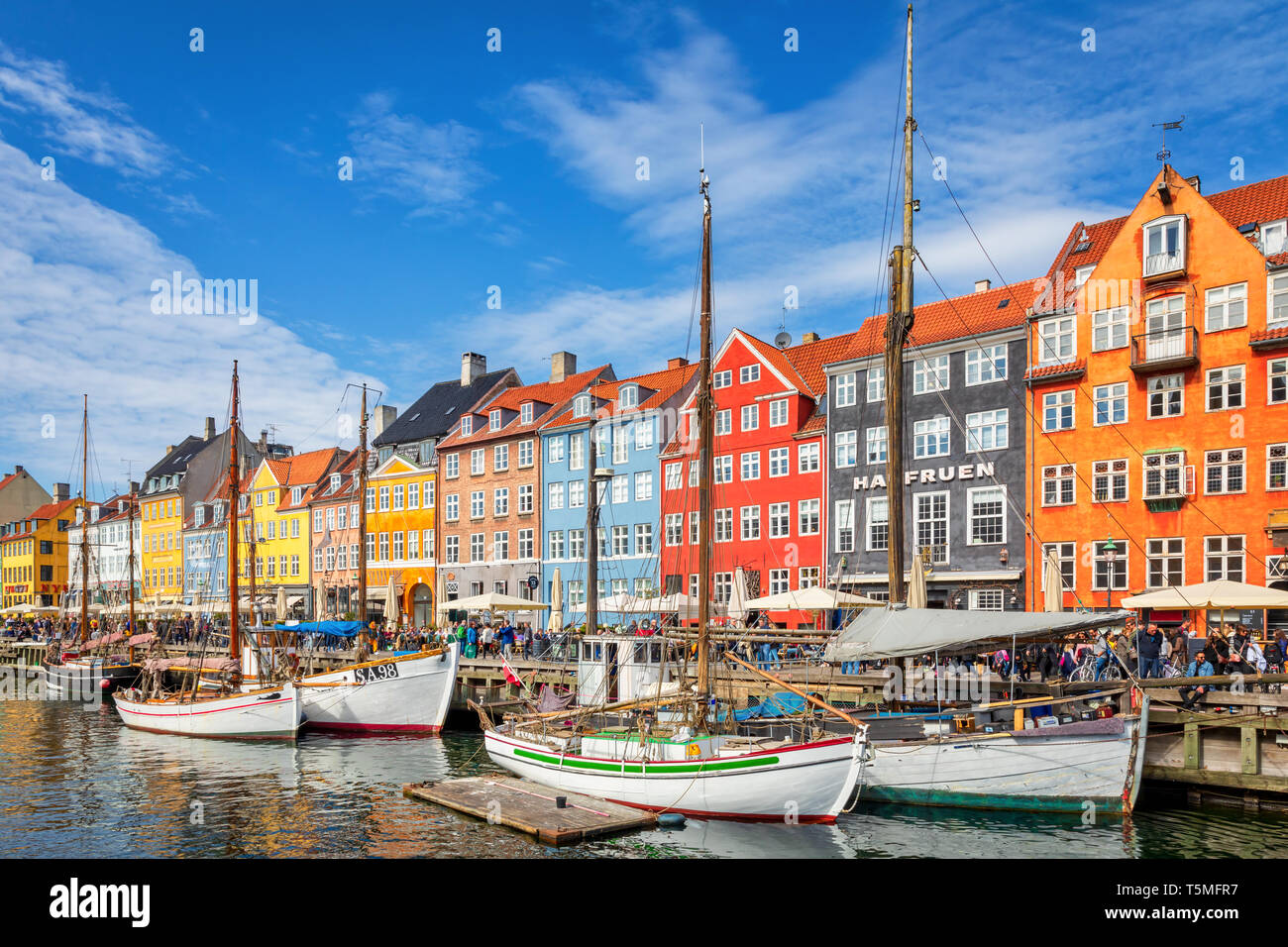 Coloured houses and sailing boats on Nyhavn canal, Copenhagen, Denmark ...