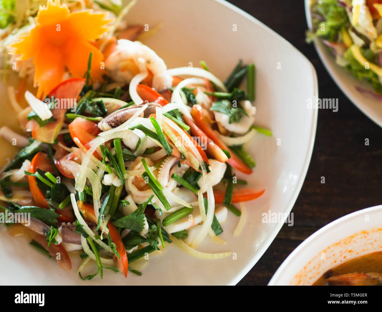 Traditional Thai cuisine. Salad with fresh vegetables and herbs and ...
