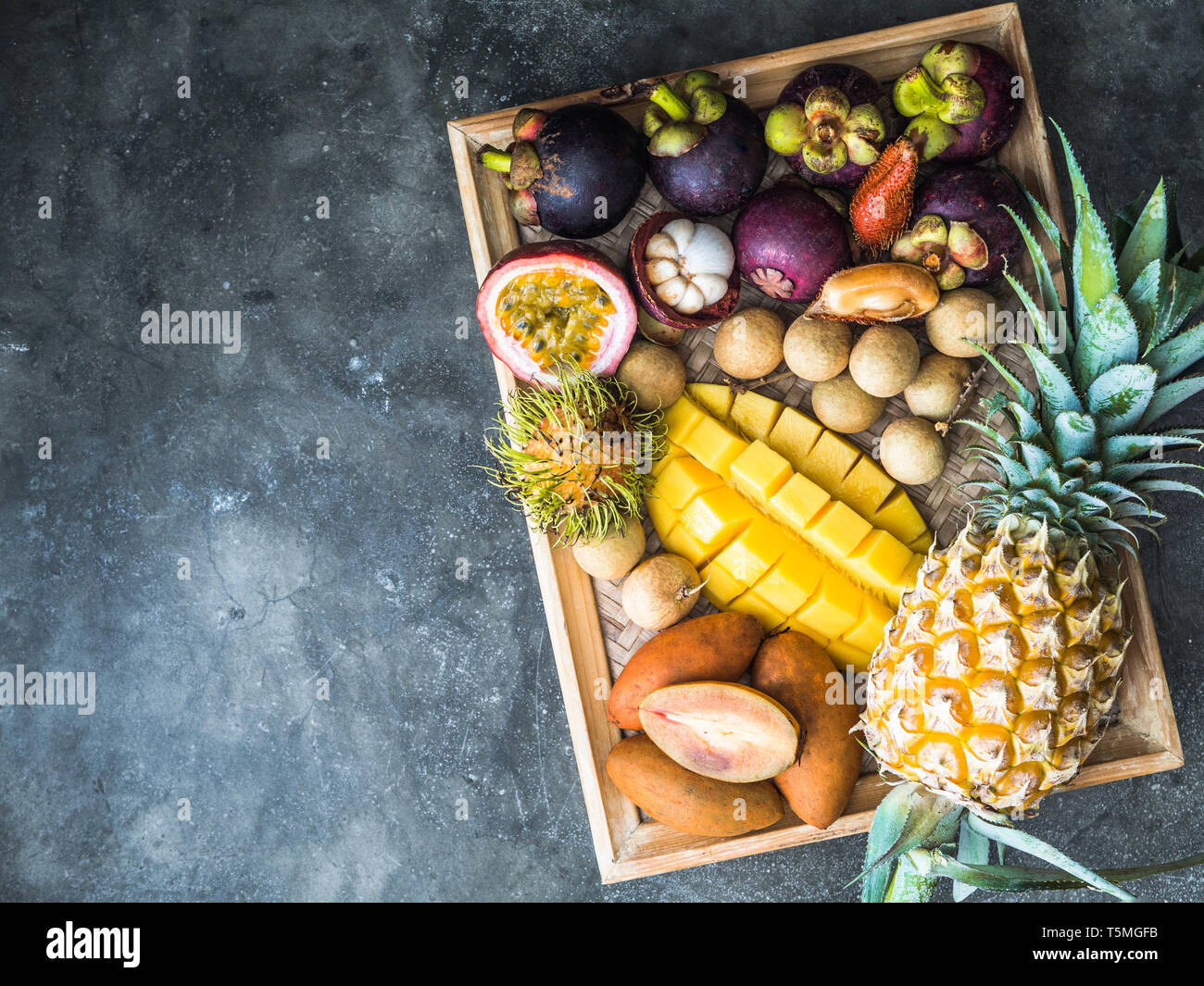 Various fresh Thai fruits - rambutan, mango, mangosteen, longan ...
