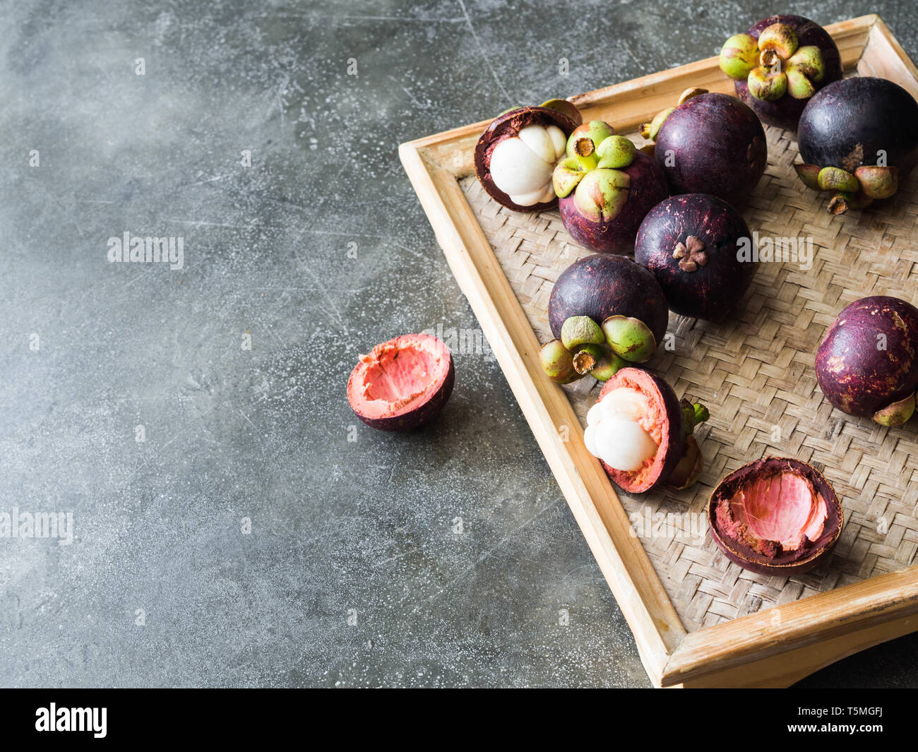 Thai queen of fruits - Mangosteen is Organic fruit on the wooden tray ...