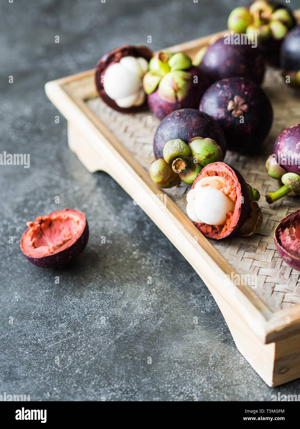 Thai queen of fruits - Mangosteen is Organic fruit on the wooden tray ...