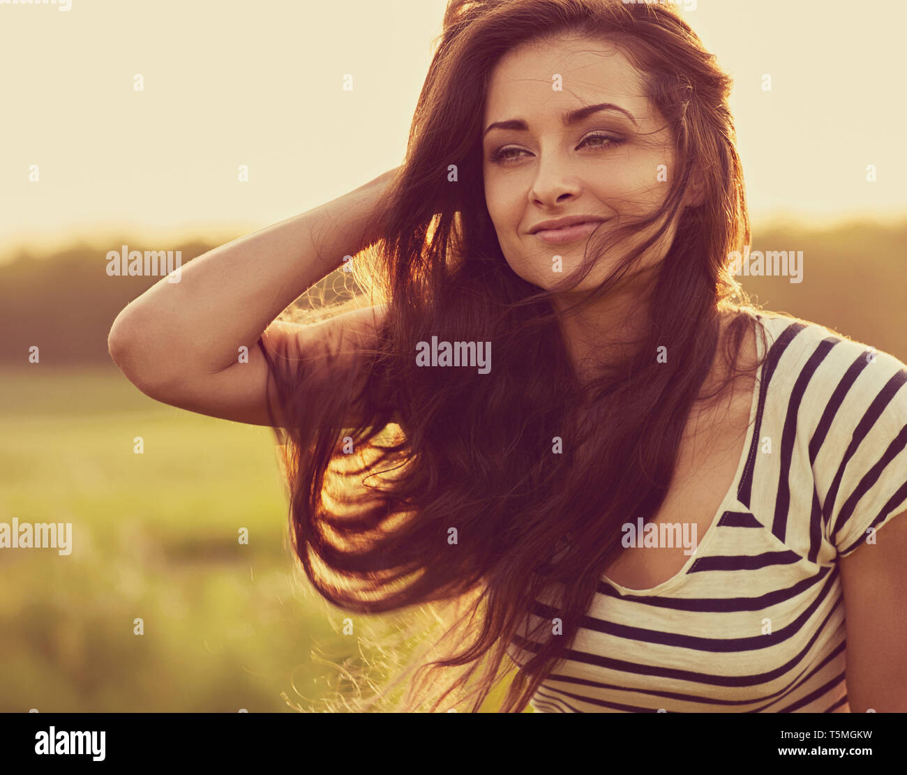 Beautiful relaxing woman with closed eyes is deep breathing and ...