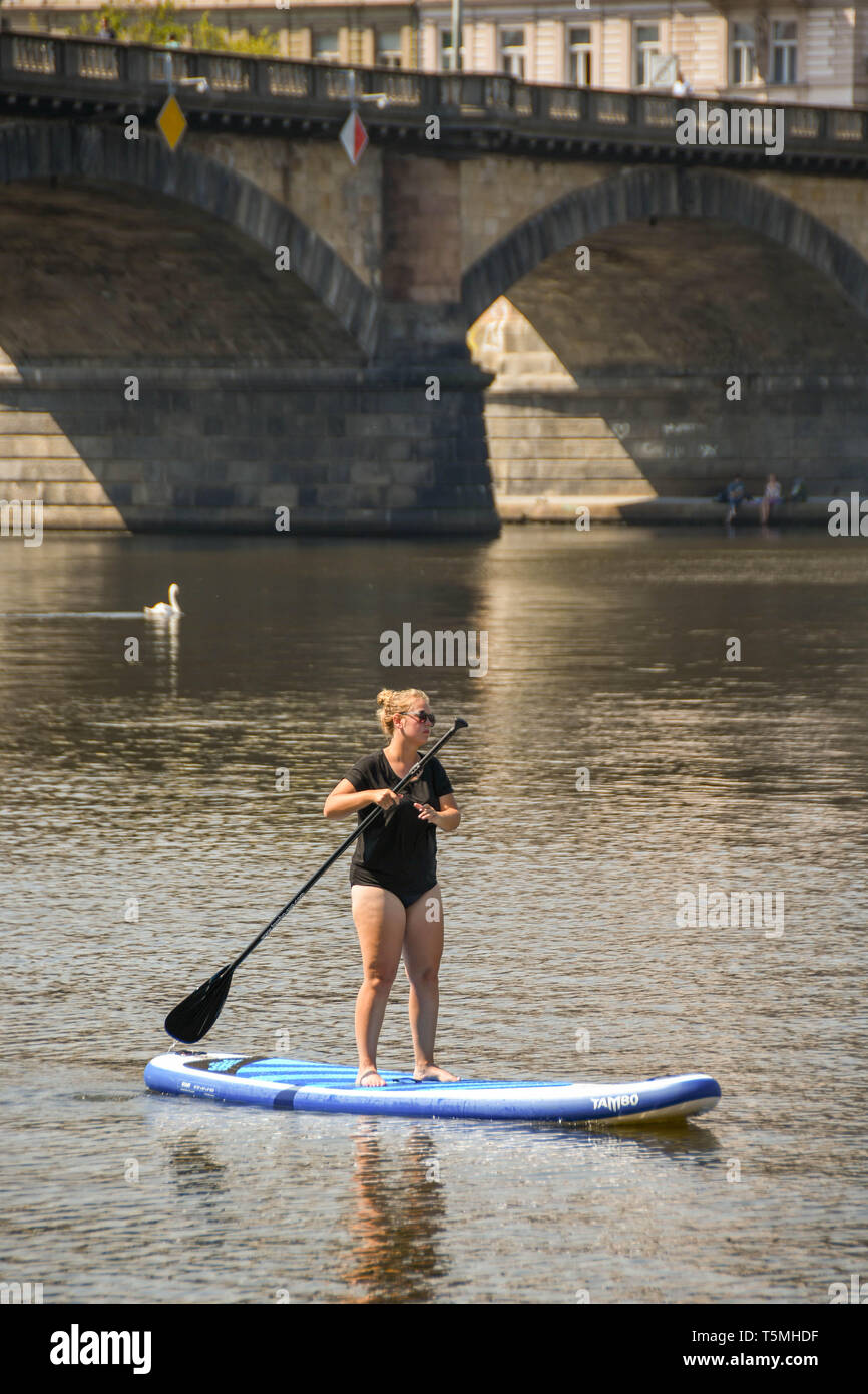 Female paddle boarding hi-res stock photography and images - Alamy
