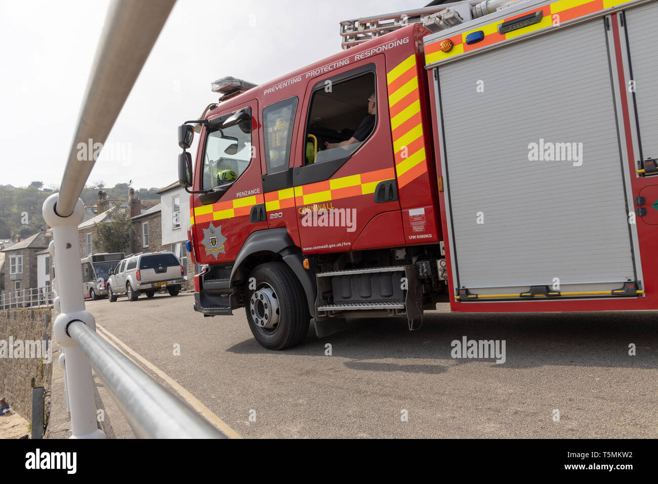 Fire engine attends Mousehole Harbour, Cornwall, UK Stock Photo - Alamy