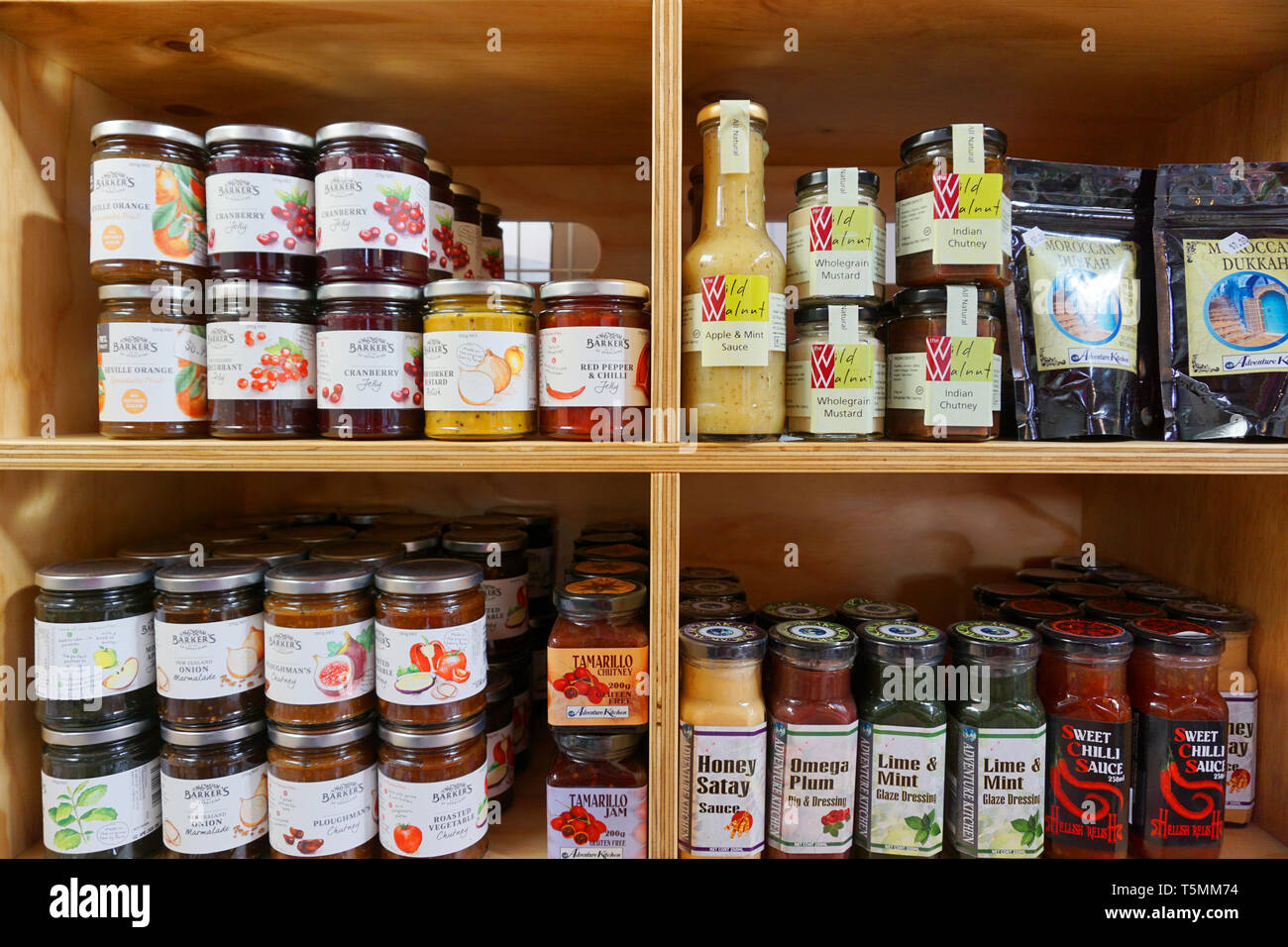 Cromwell/ New Zealand:Jam fruit jar on wooden shelf strawberry apricot ...
