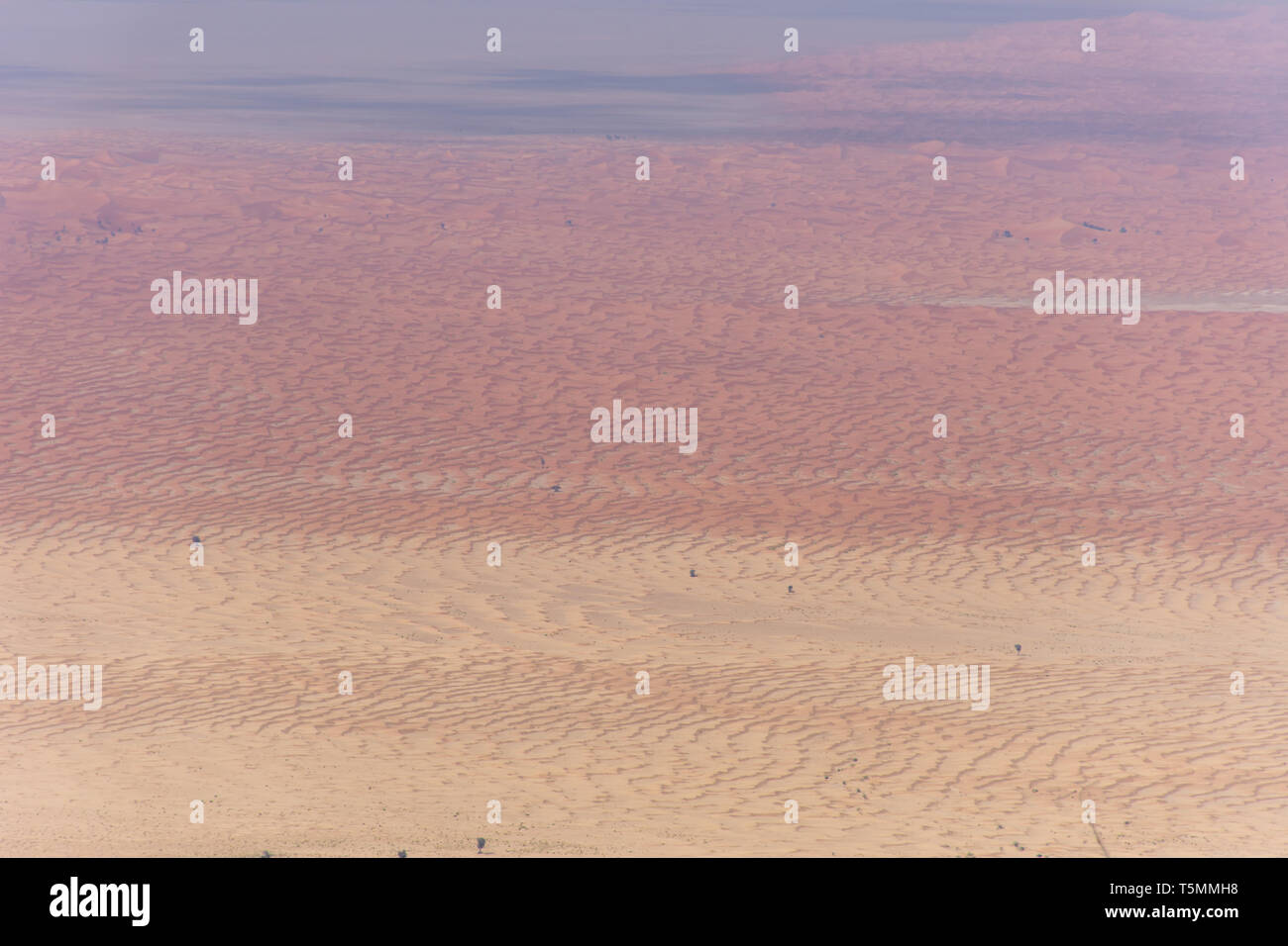 Aerial view of the desert red, orange, and yellow sand in Al Ain, Abu ...