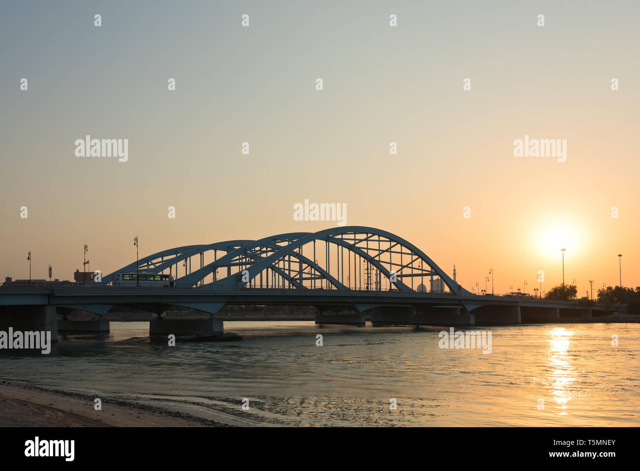 Maqta Bridge in Abu Dhabi, United Arab Emirates. Sunset view with water ...