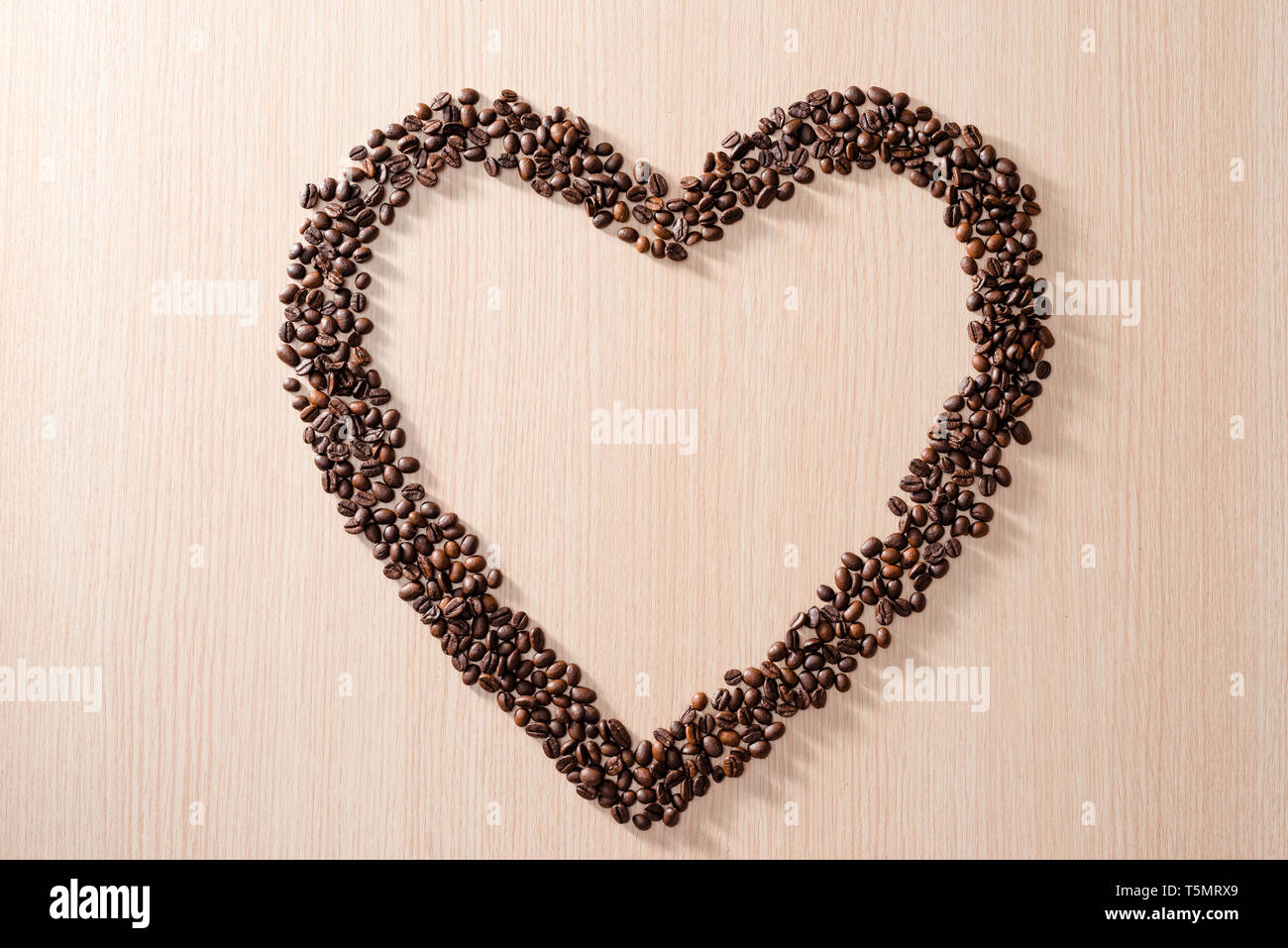 Heart shape with coffee beans Stock Photo - Alamy