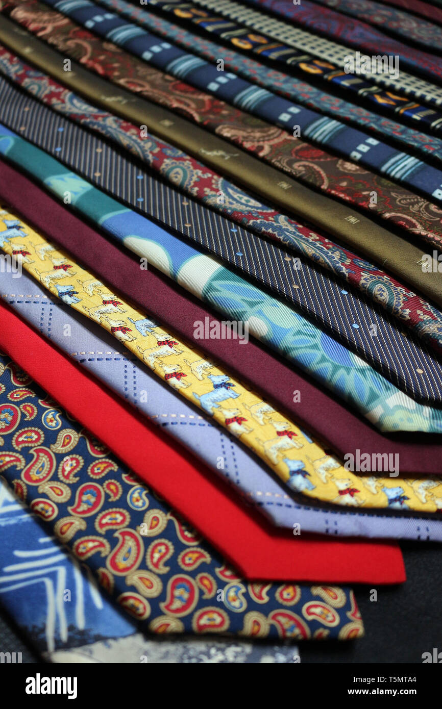 A row of different coloured and patterned ties Stock Photo - Alamy