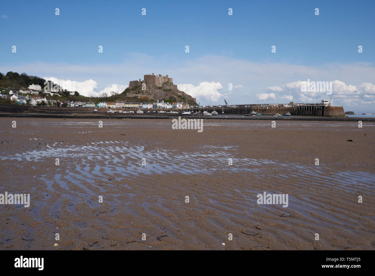 Mont Orgueil castle, also known as Gorey Castle, with the beach and ...