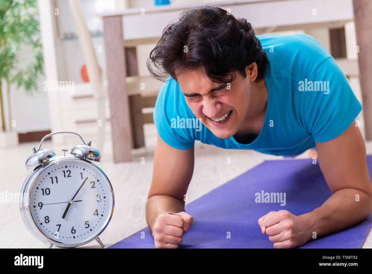 Young handsome man doing morning exercises Stock Photo - Alamy