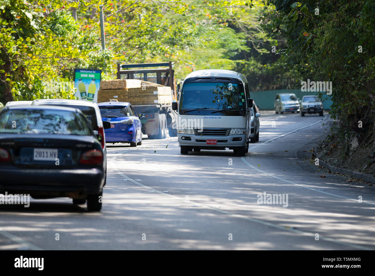 A Juta tour bus is seen in traffic heading out of Ocho Rios town centre ...