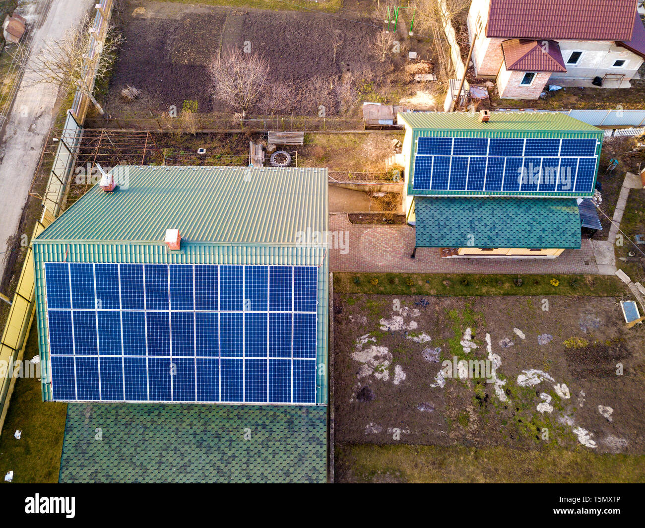 Aerial top view of new modern residential house cottage with blue shiny ...