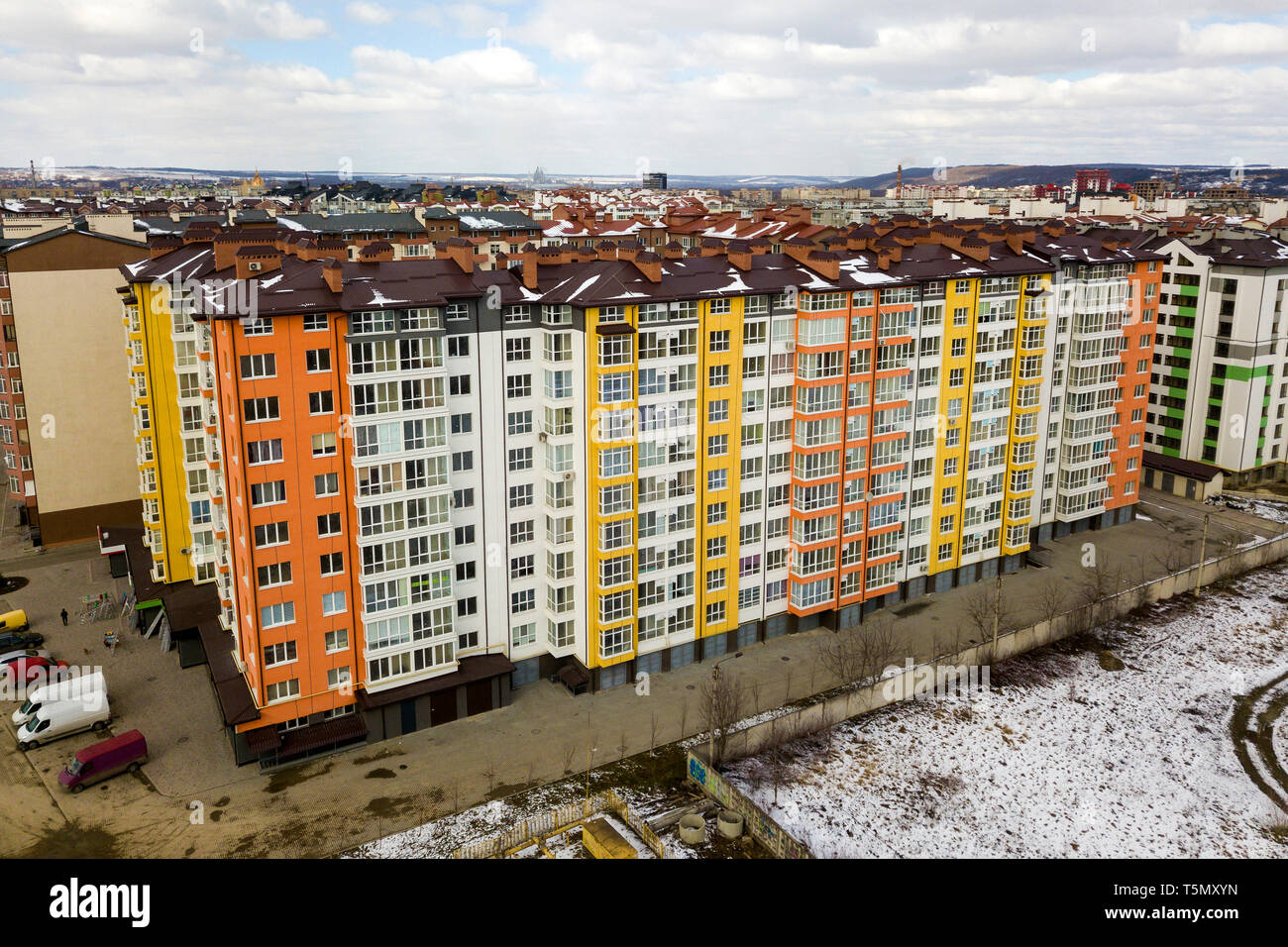 Apartment tall building complex on street corner, top view on bright ...