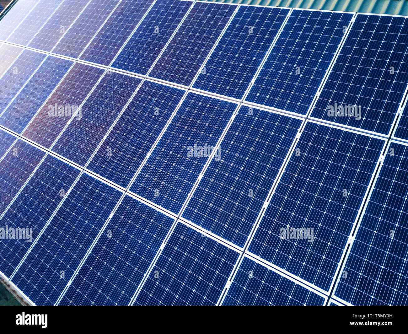 Close-up surface of blue shiny solar photo voltaic panels system on ...
