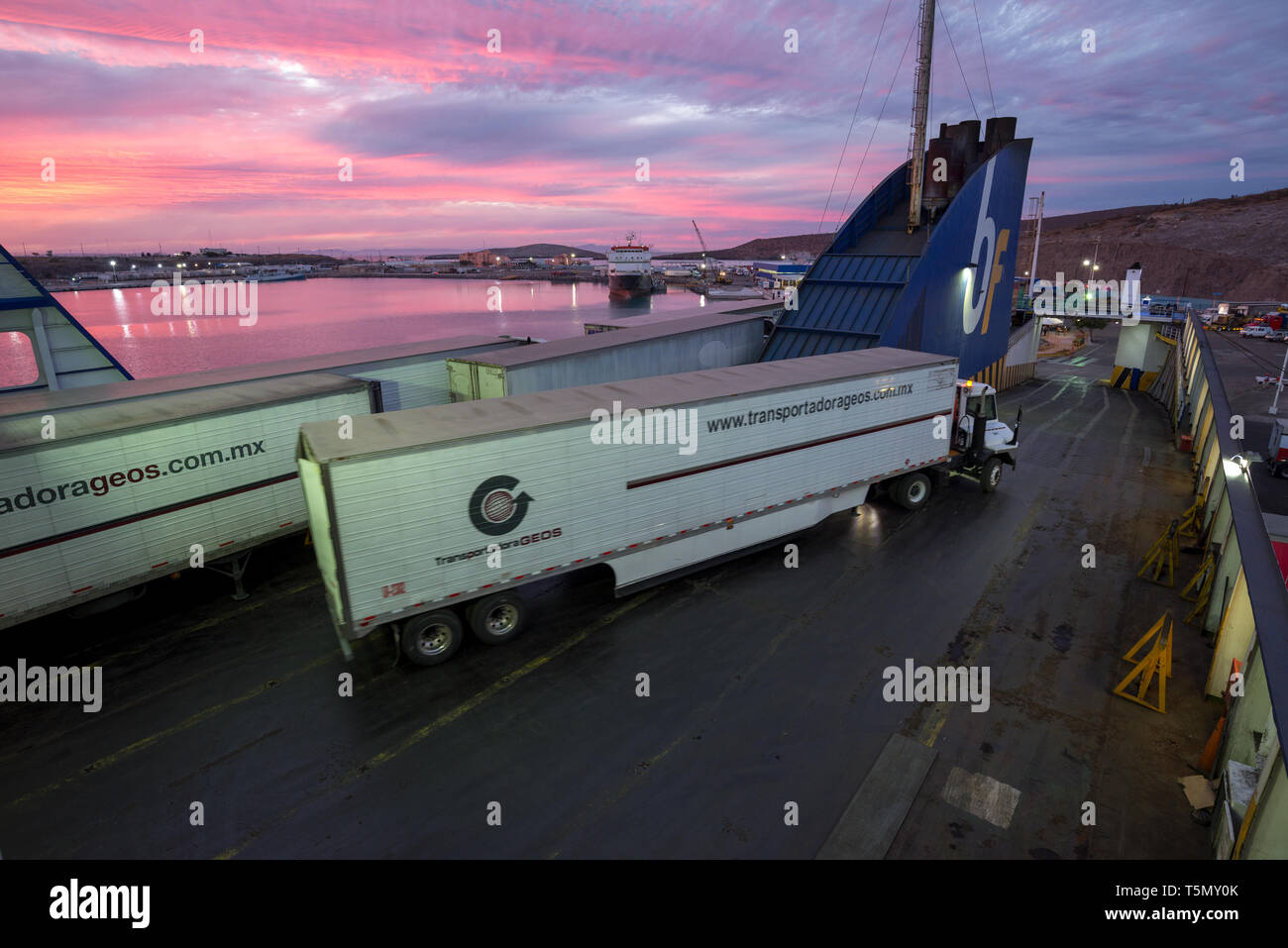 Driving trucks onto a Baja ferry in Pichilingue, Baja California Sur ...