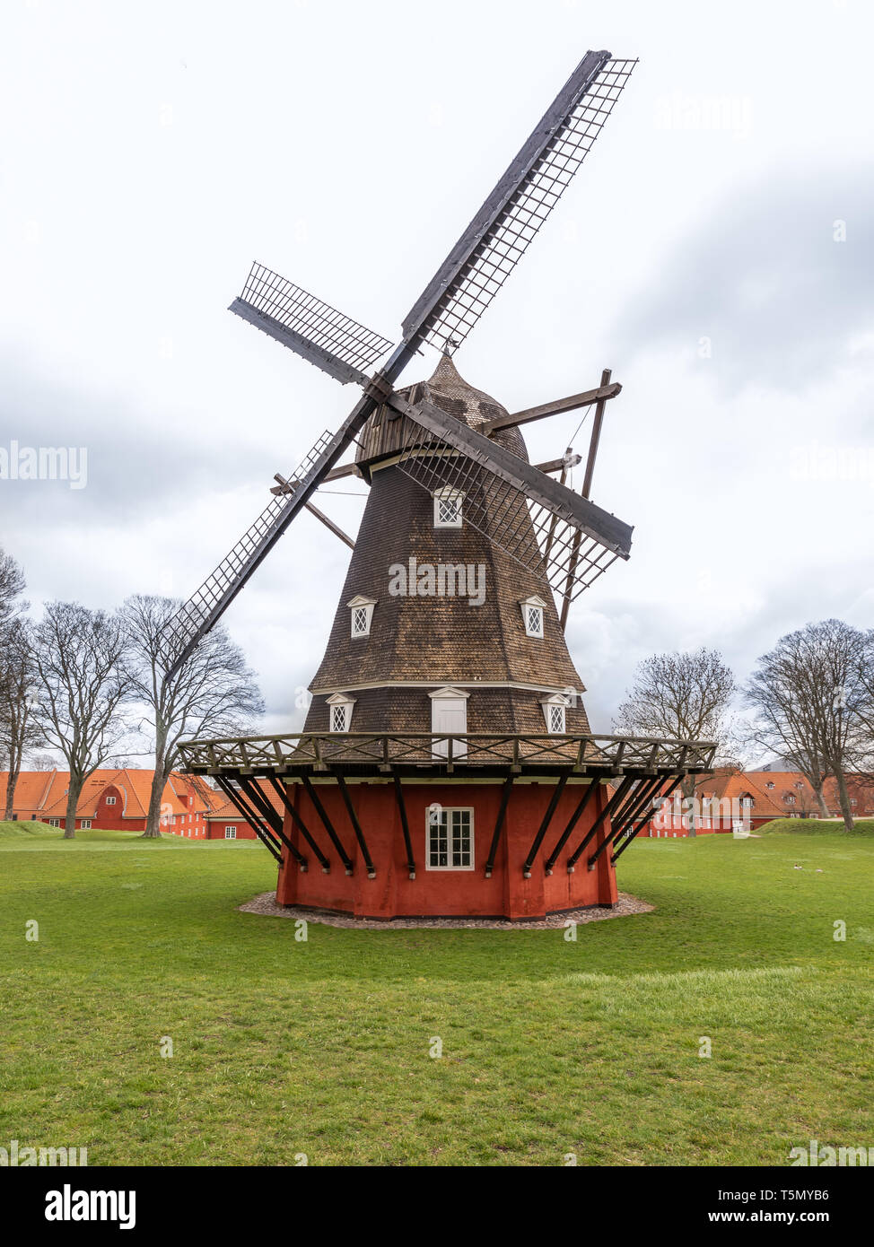 Ancient windmill from the main wooden structure and the base of red ...
