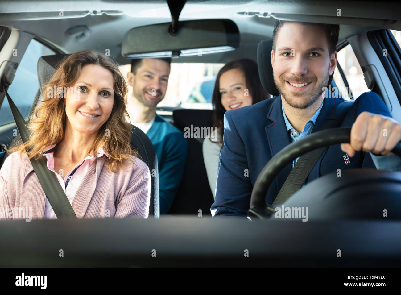 Group Of Happy Friends Having Fun In The Car Stock Photo - Alamy