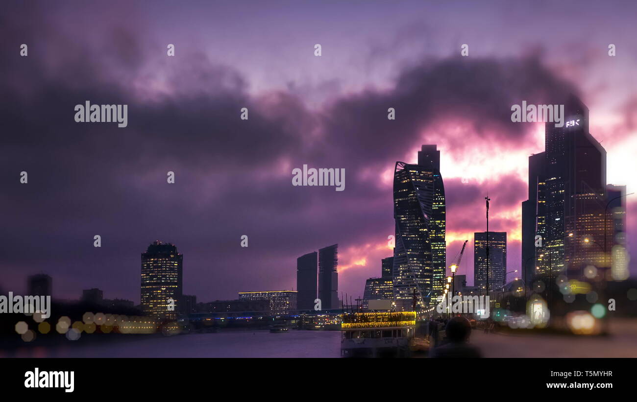 concept of a modern city business center in sunset background with high ...