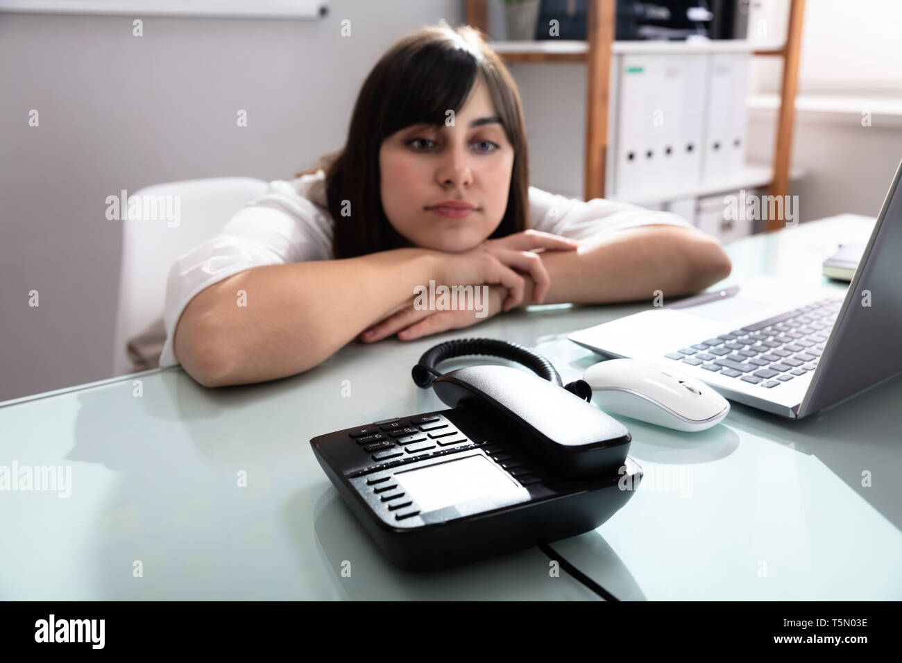 Female waiting for a call hi-res stock photography and images - Alamy