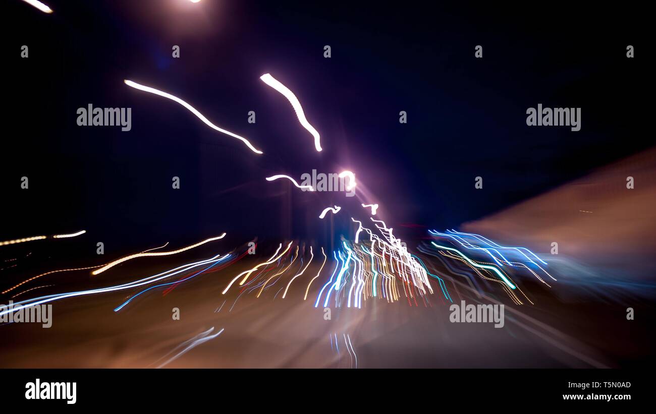 Fast car trip time lapse on the highway by night seen from the car ...