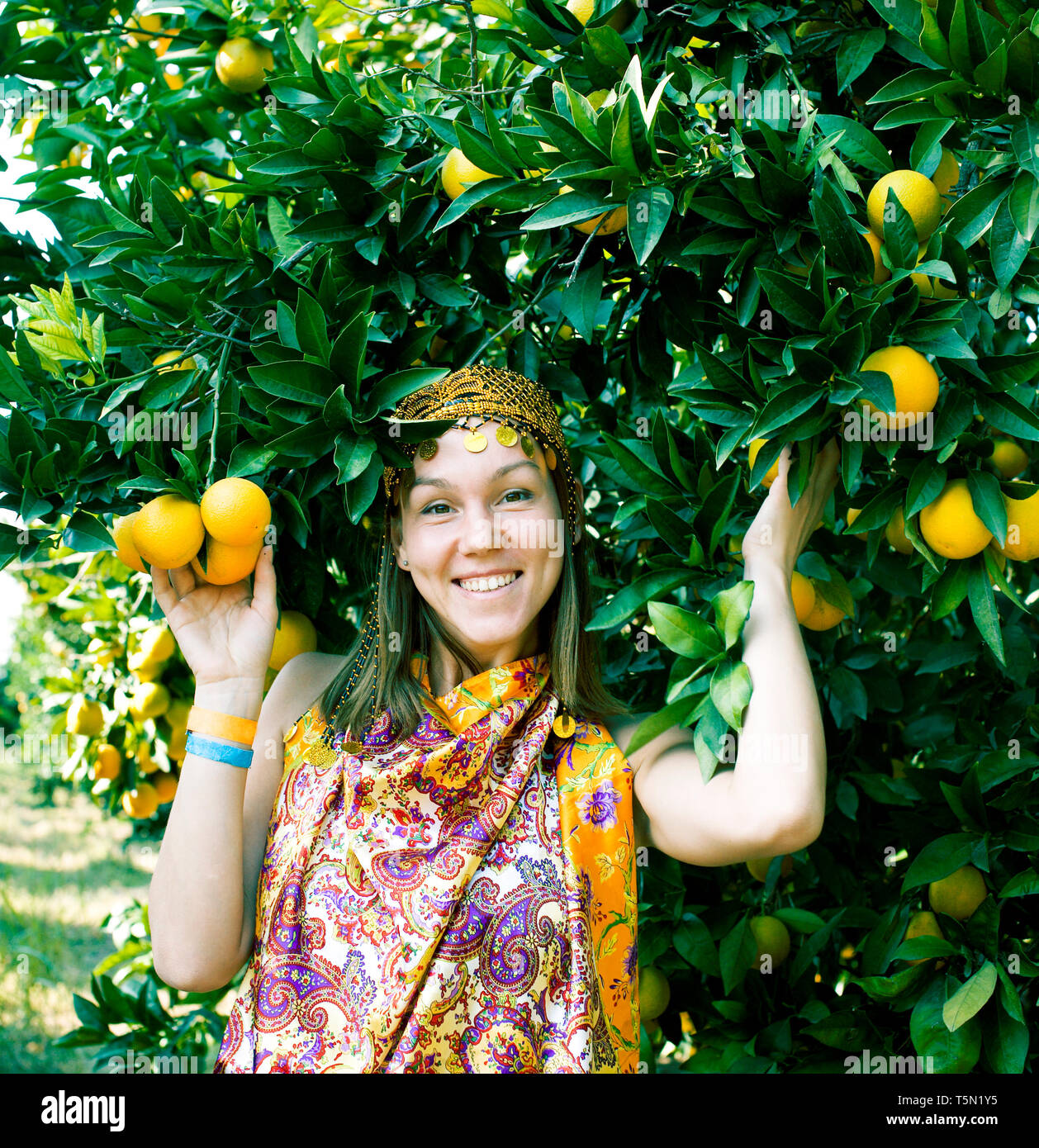 pretty islam woman in orange grove smiling, real muslim girl Stock ...