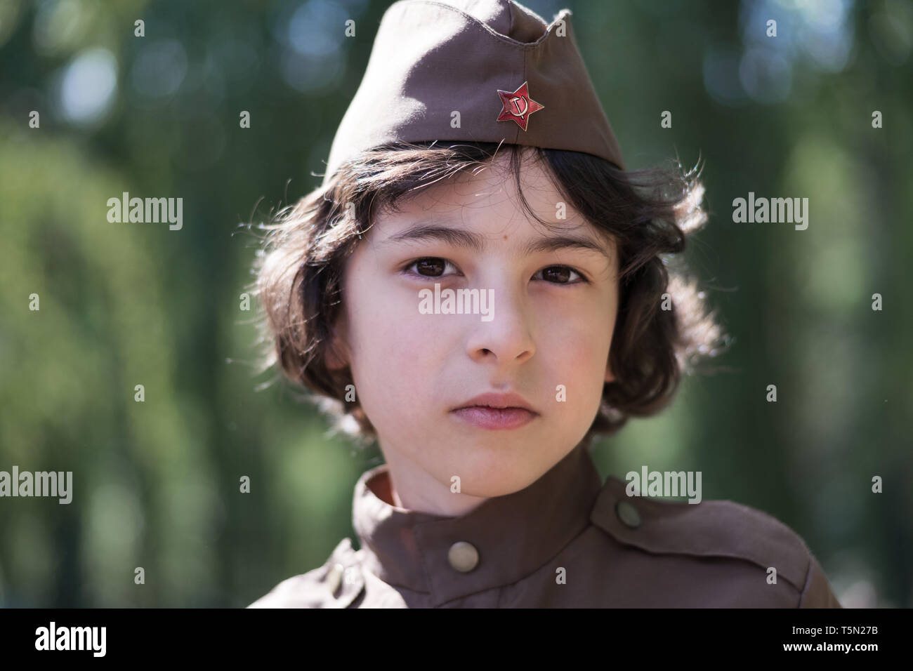 Portrait of a boy in the uniform of a soldier of the Red Army during ...