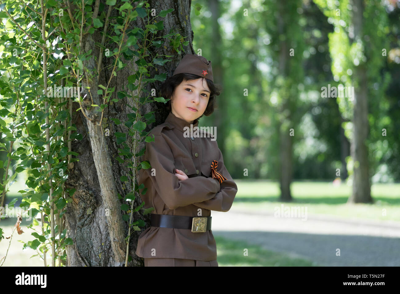 Portrait of a boy in the uniform of a soldier of the Red Army during ...