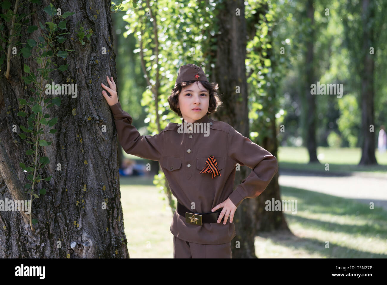 Portrait of a boy in the uniform of a soldier of the Red Army during ...