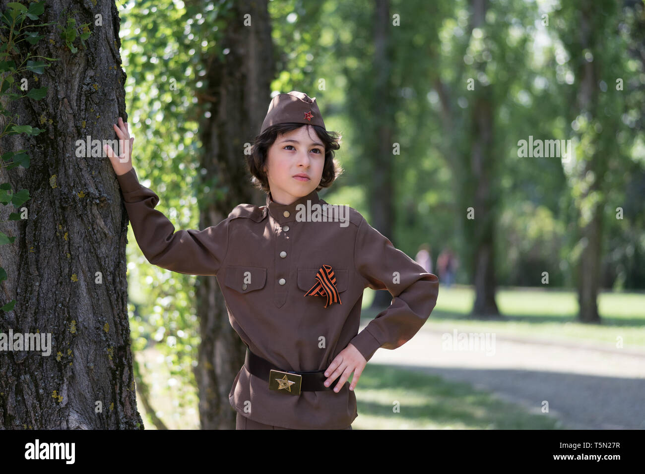 Portrait of a boy in the uniform of a soldier of the Red Army during ...
