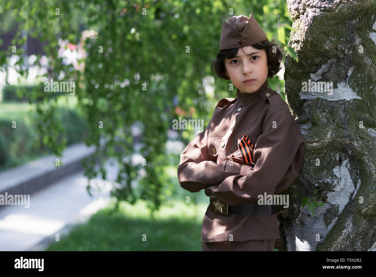 Portrait of a boy in the uniform of a soldier of the Red Army during ...