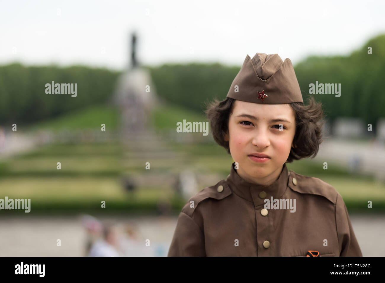 Portrait of a boy in the uniform of a soldier of the Red Army during ...