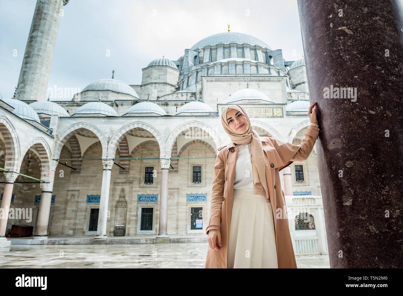 Beautiful Muslim woman in headscarf and fashionable modern trendy ...
