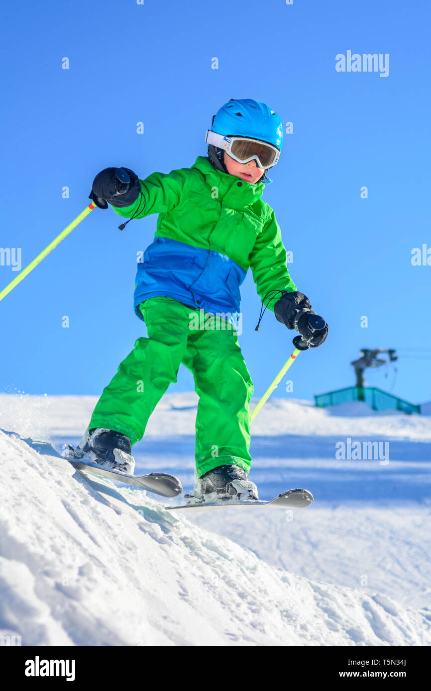 Courageous little alpine skiers on slope Stock Photo - Alamy