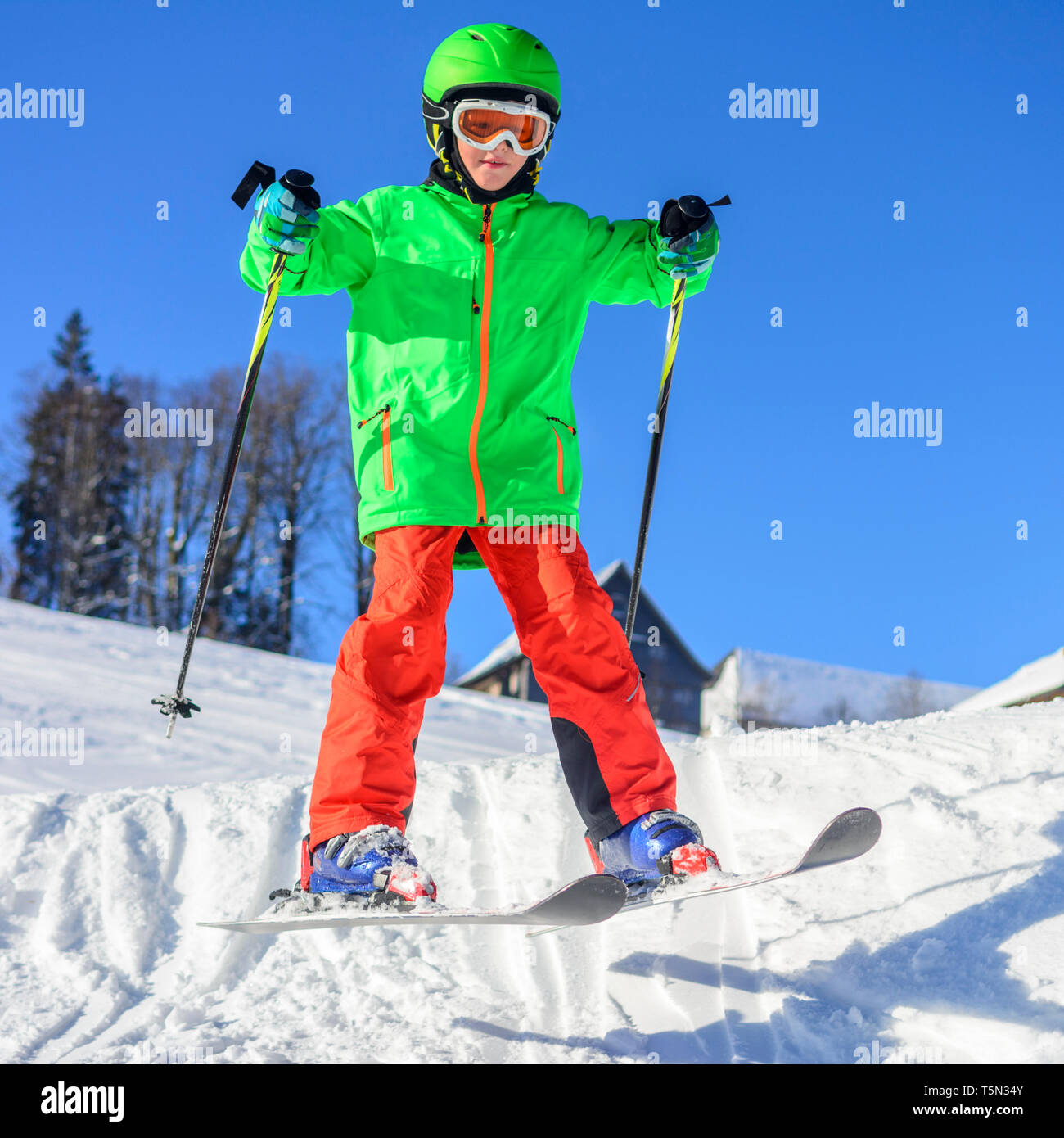 Courageous little alpine skiers on slope Stock Photo - Alamy