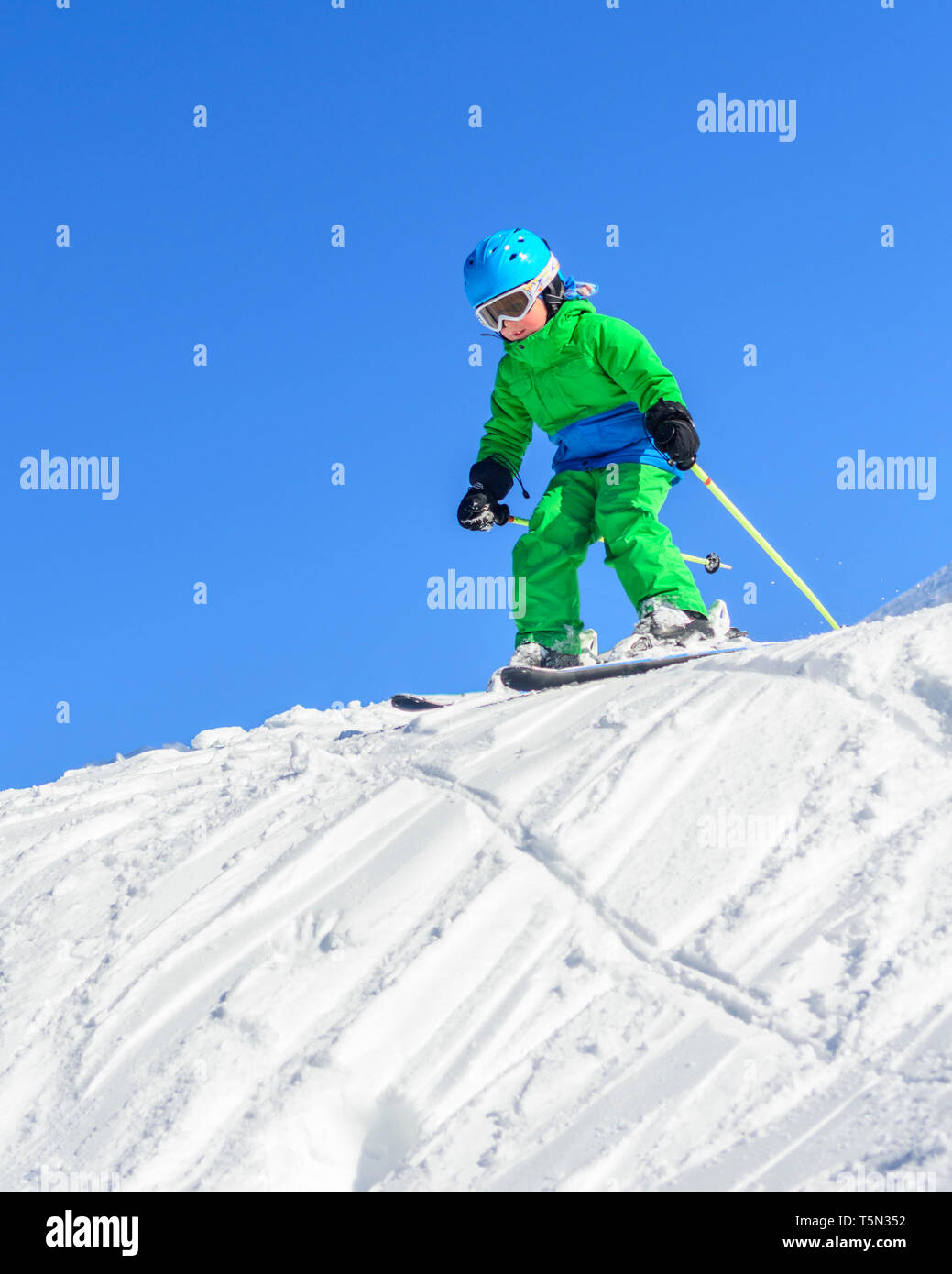 Courageous little alpine skiers on slope Stock Photo - Alamy