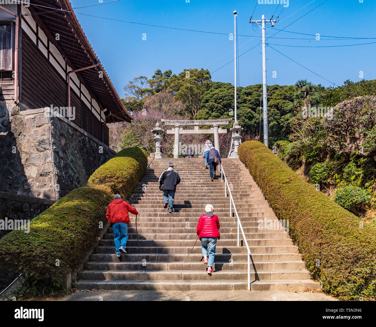 27 March 2019: Gamagori, Japan - Visitors climbing the steps to the ...