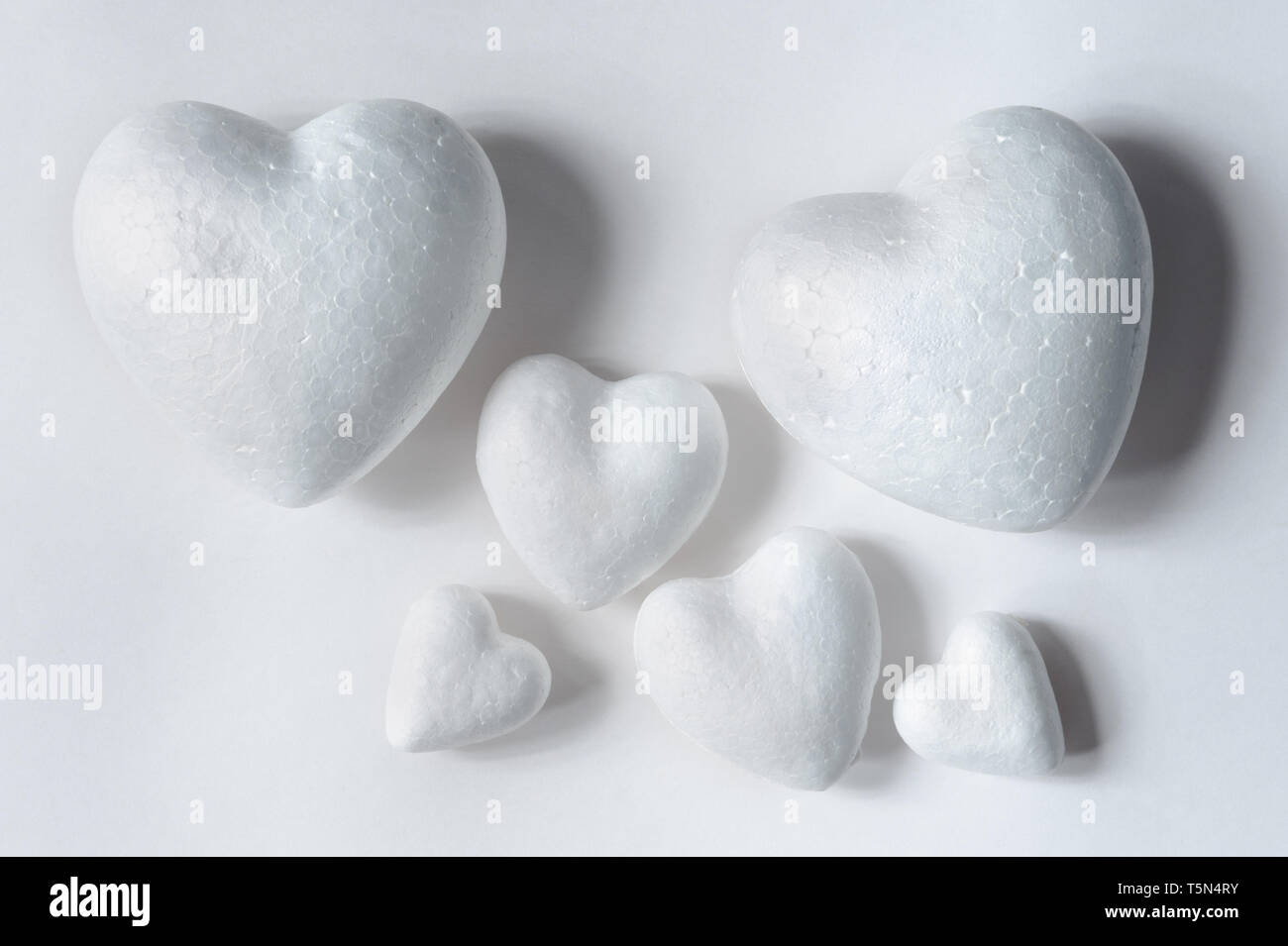 many hearts as a symbol of family on white Stock Photo - Alamy