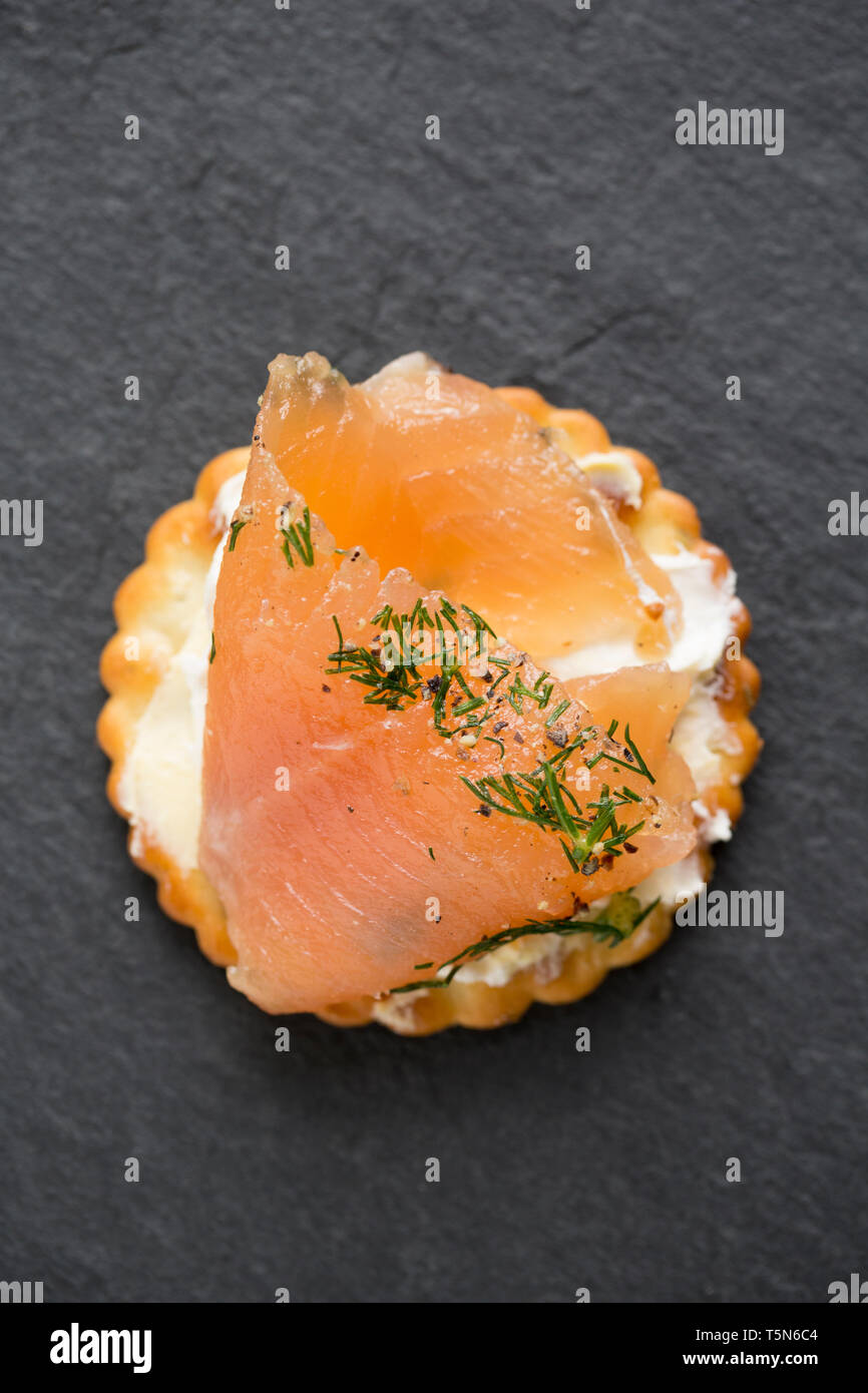 A single slice of gravadlax from a rainbow trout fillet, Oncorhynchus ...