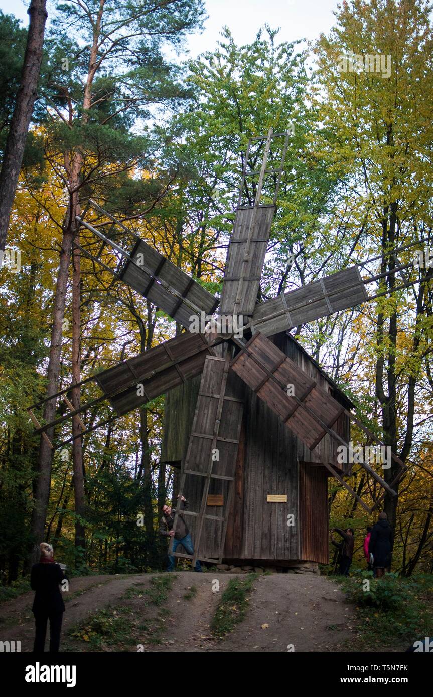 Wooden windmill in autumn day among trees Stock Photo - Alamy